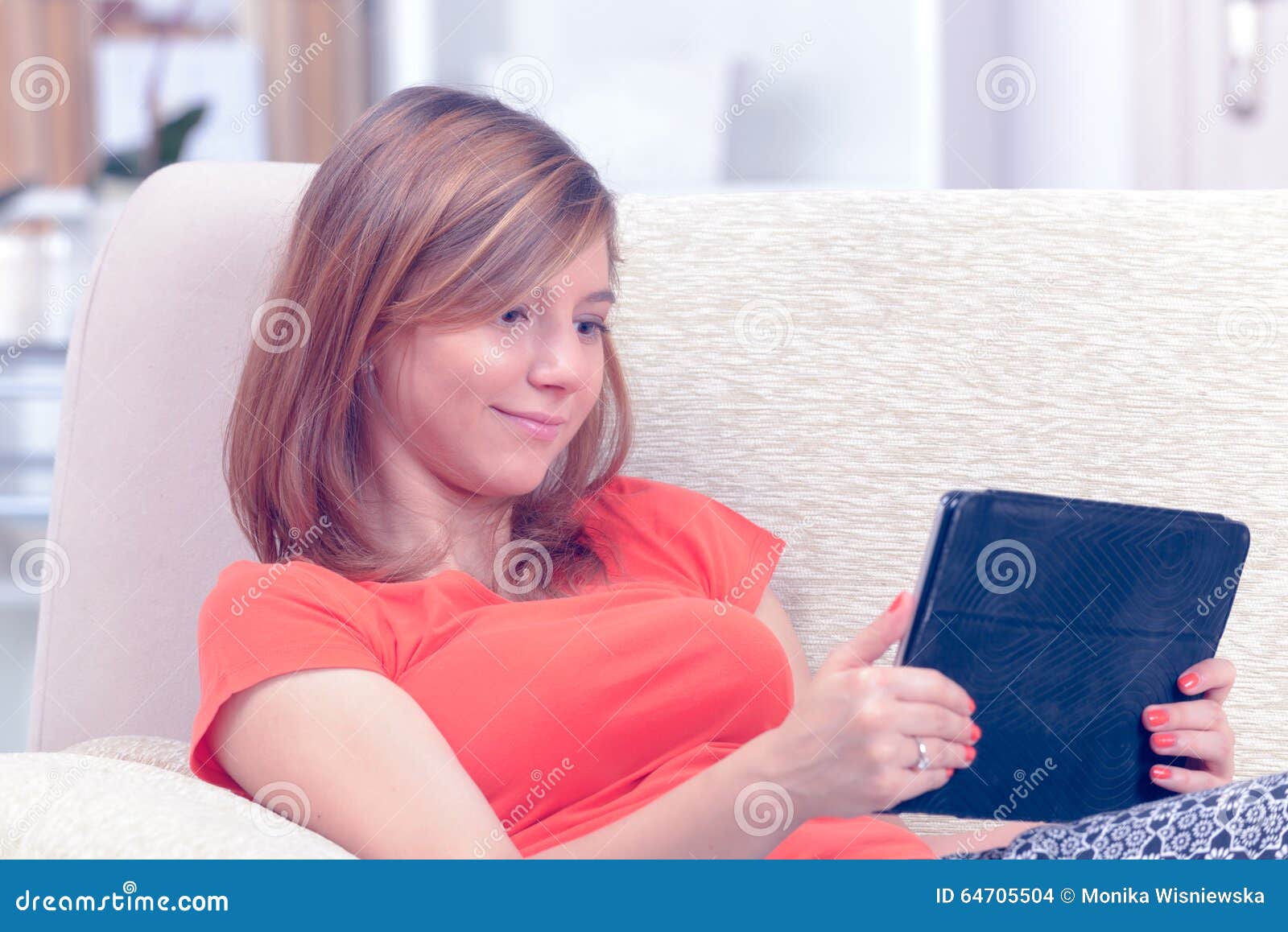 Woman using tablet stock photo. Image of sitting, casual - 64705504