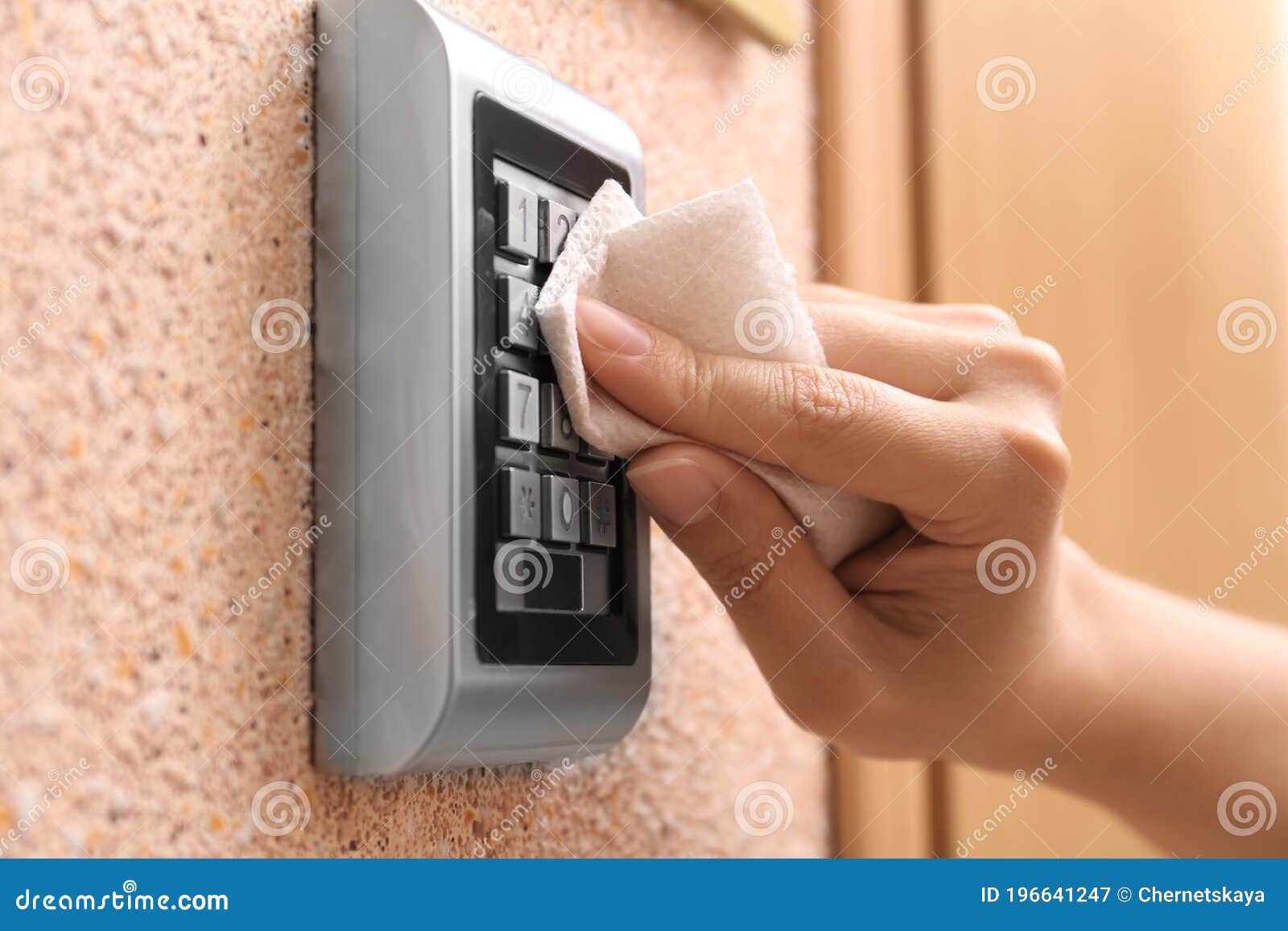 Woman Using Tissue Paper To Press Keys of Digital Access Lock, Closeup ...
