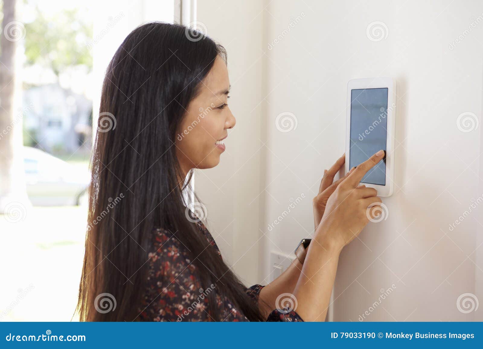 Woman Using Touch Pad in Entrance To Home Stock Photo - Image of tablet ...