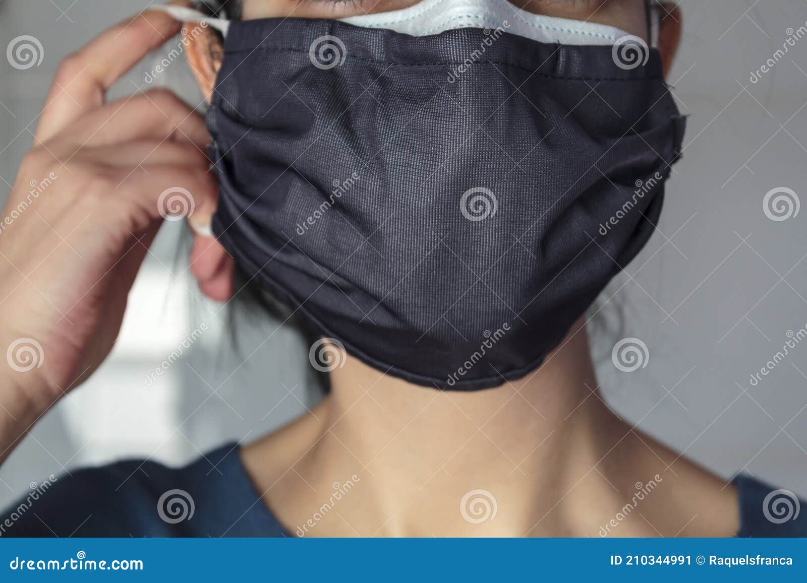 Woman Using Two Face Masks at the Same Time Stock Image - Image of ...