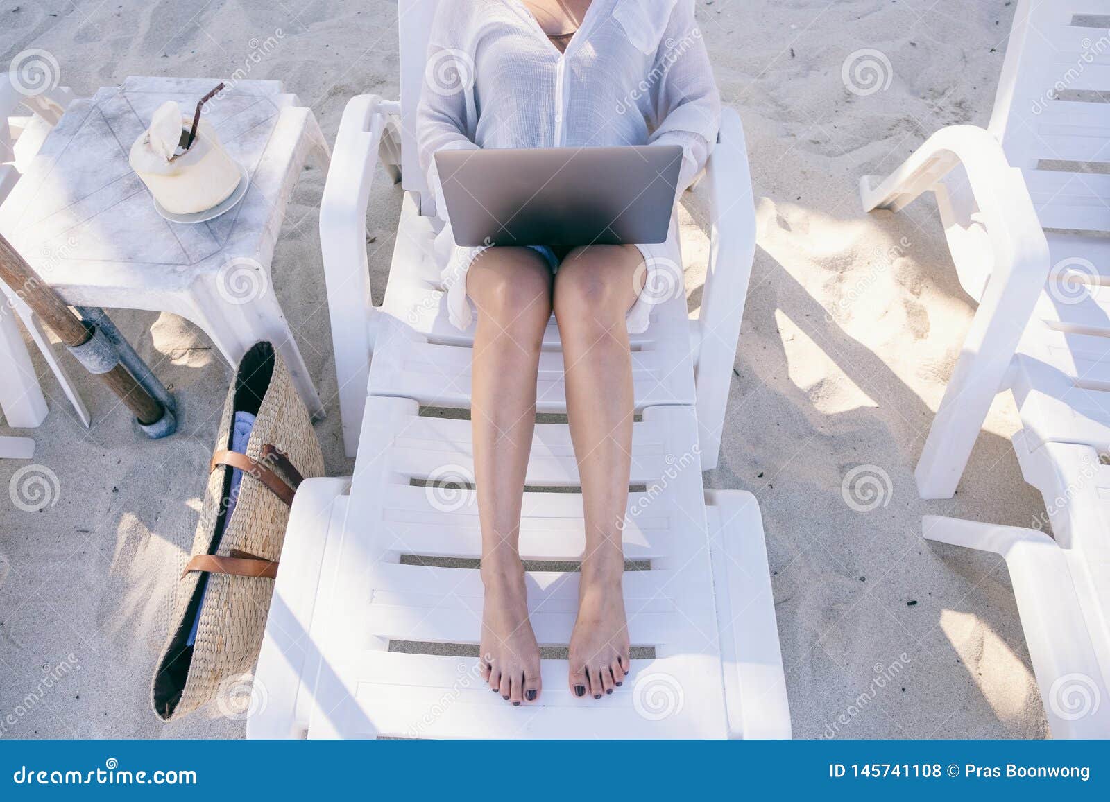 A Woman Using and Typing on Laptop Computer with Blank Desktop Screen ...