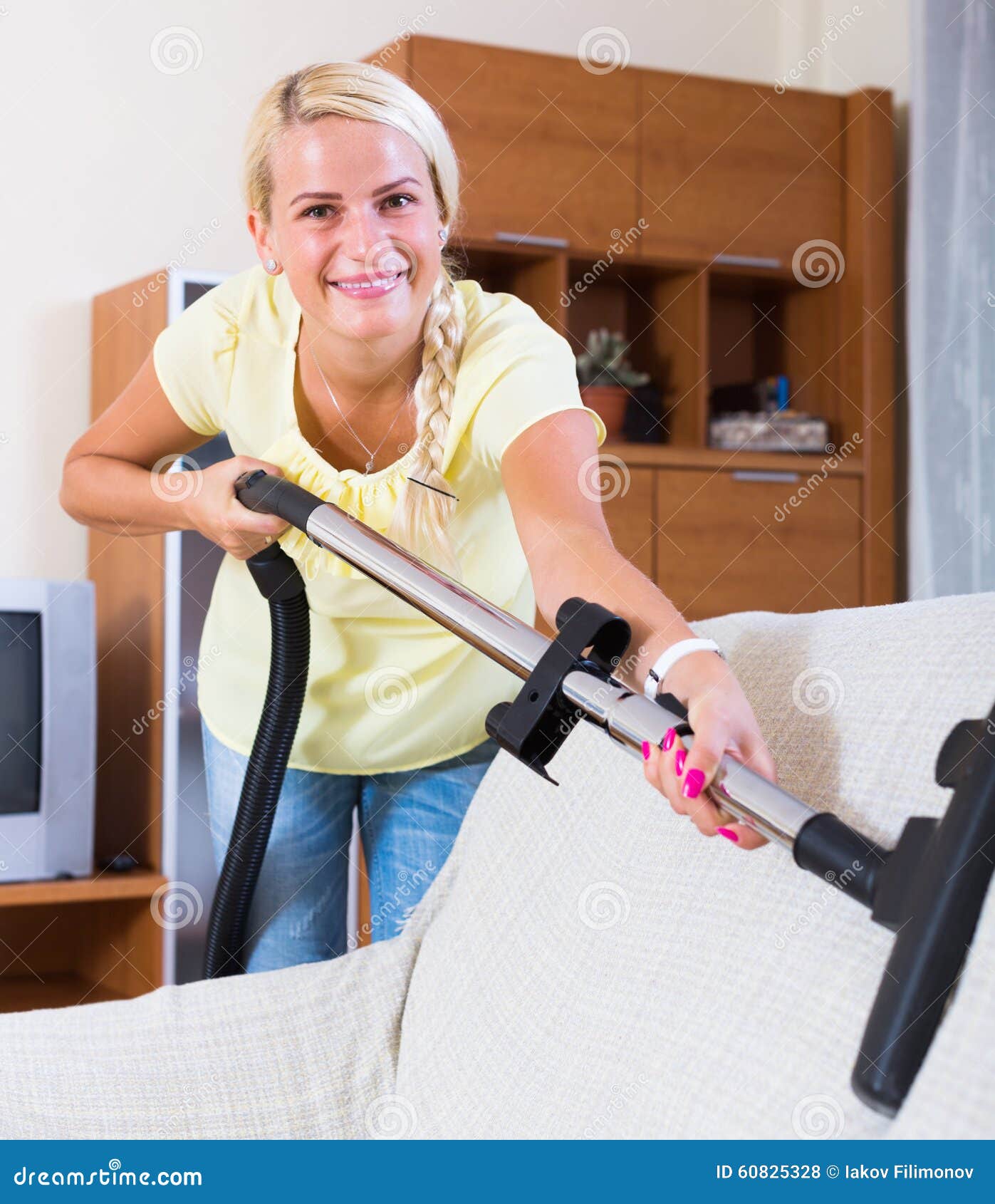 Woman using vacuum cleaner stock photo. Image of hoover - 60825328