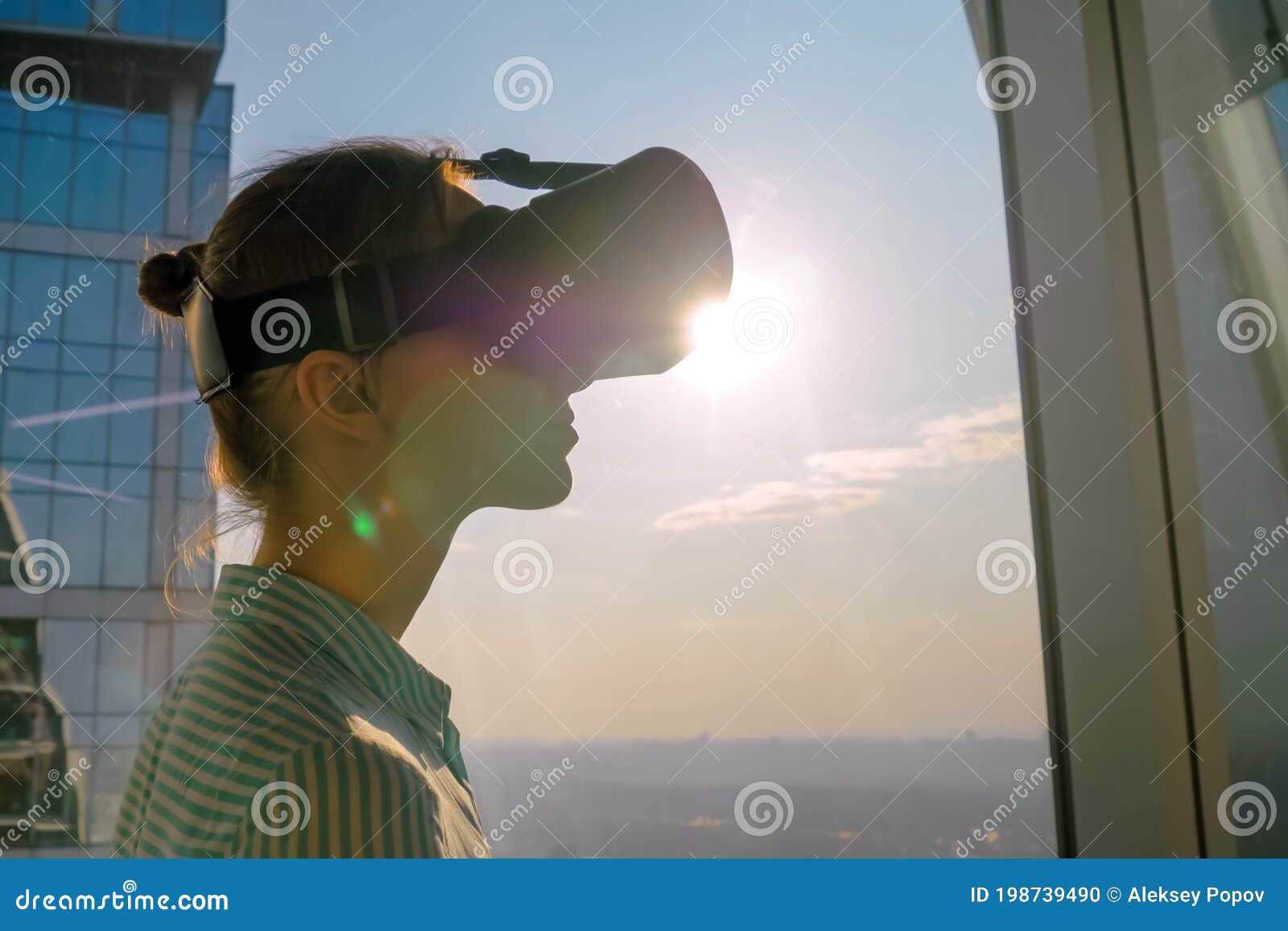 Young Woman Using Virtual Reality Headset Against Skyscraper Window ...