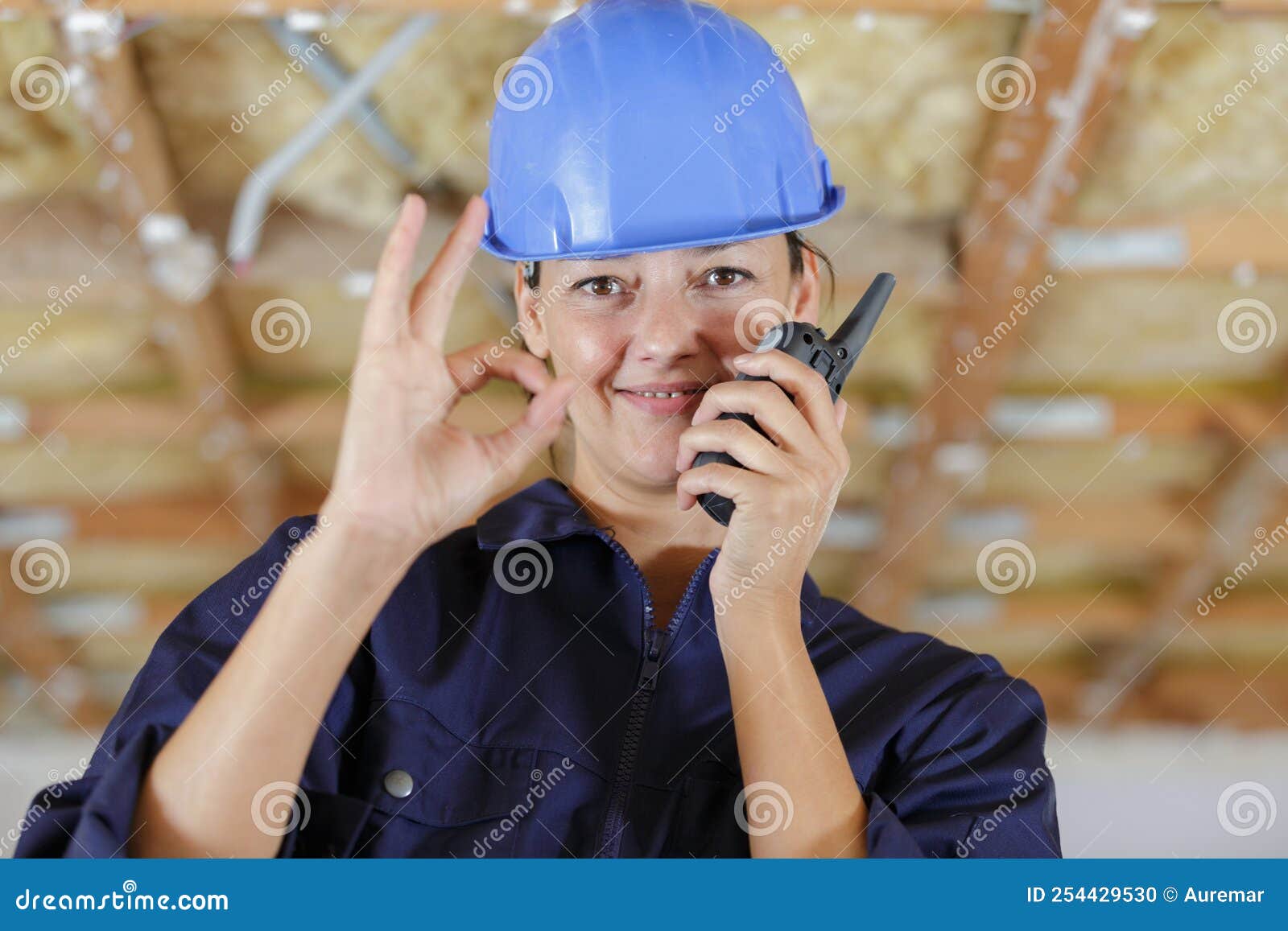 Woman using walkie talkie stock photo. Image of student - 254429530