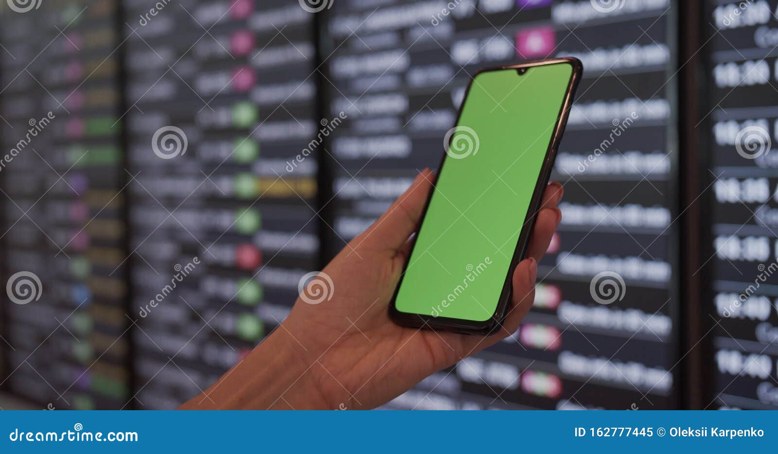 Woman Using White Mobile Device with Green Screen in Terminal Hall ...