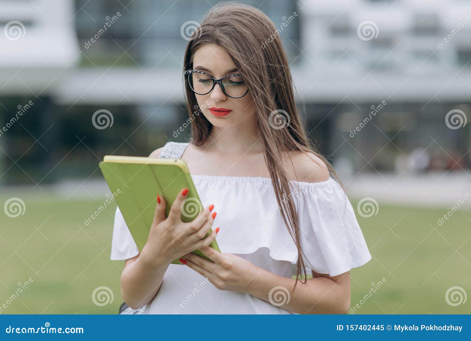 Woman Using White Tablet Device Computer with Green Screen. Touchscreen ...