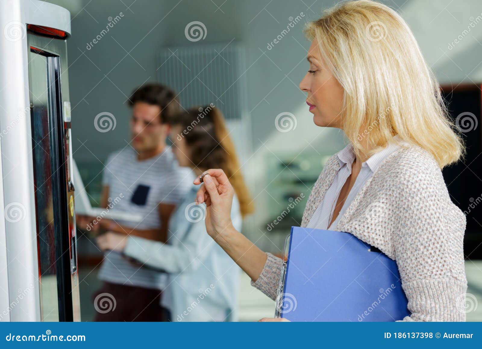 Woman at vending machine stock photo. Image of person - 186137398