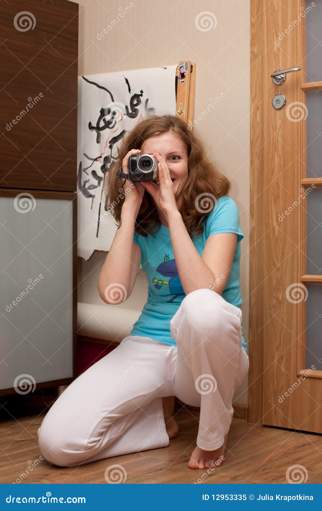 WOMAN with VIDEO CAMERA stock image. Image of hobby, female - 12953335