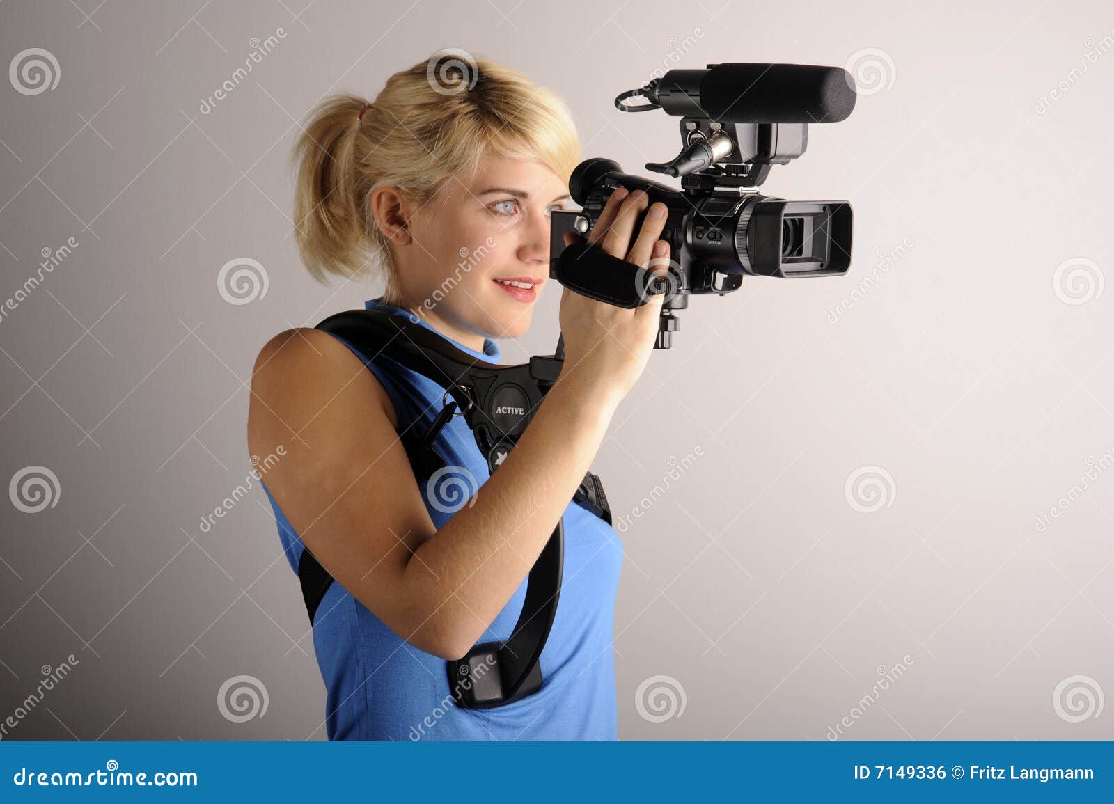 Woman with video camera stock photo. Image of microphone - 7149336