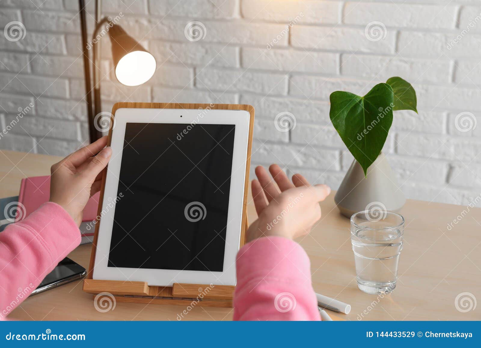 Woman Video Chatting on Tablet at Table. Space for Design Stock Image ...