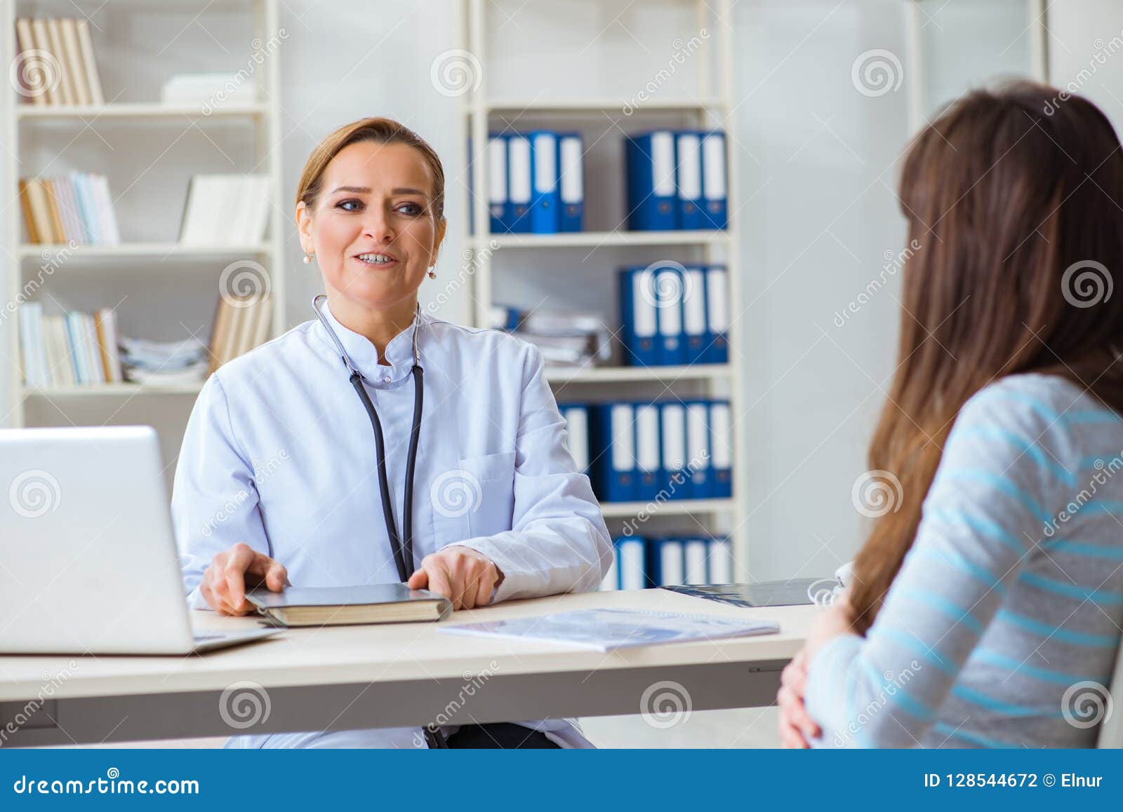 The Woman Visiting Female Doctor for Regular Check-up Stock Photo ...