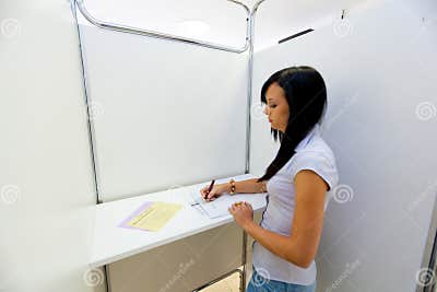 Woman in Voting Booth stock image. Image of indoors, camera - 11861099