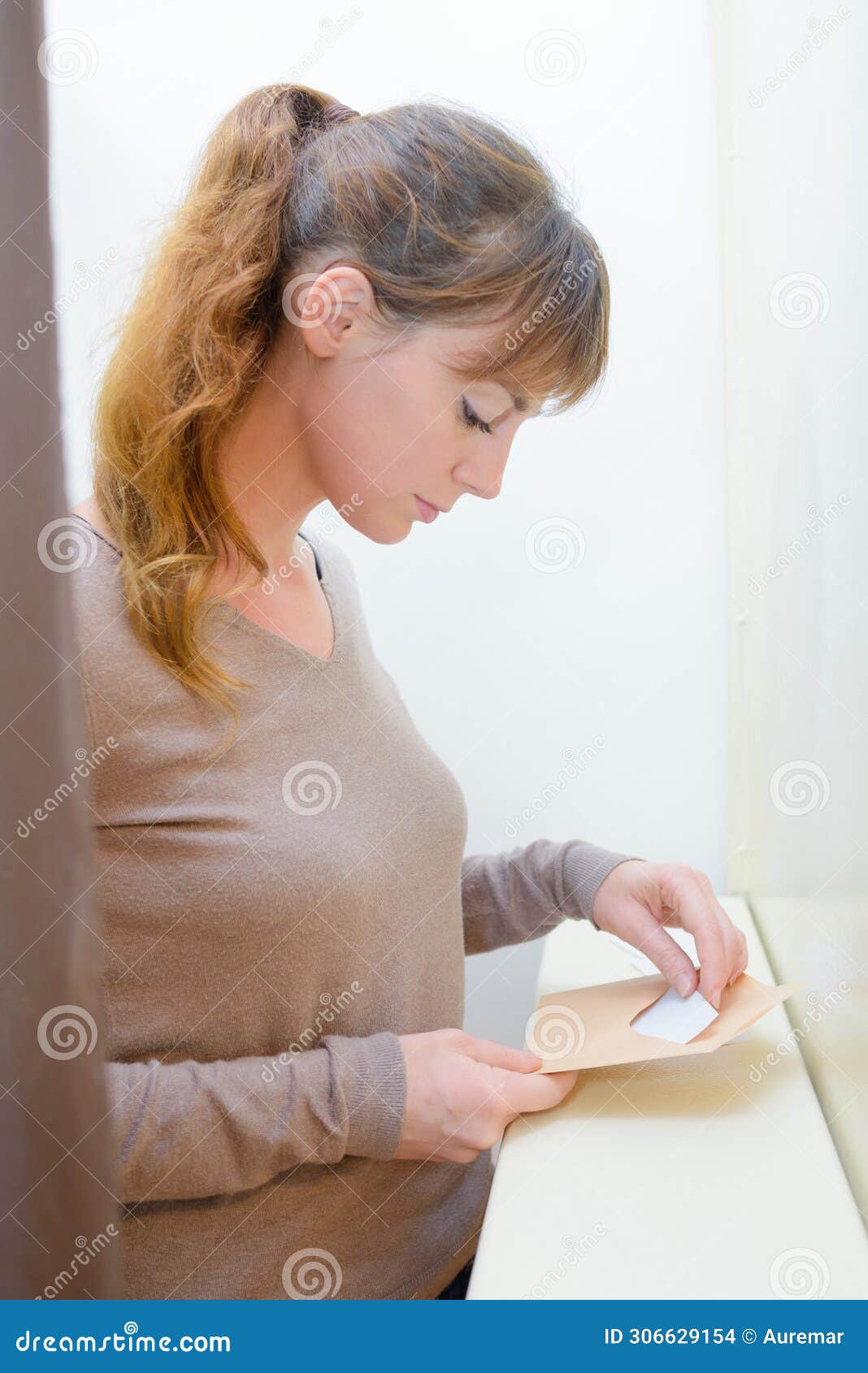 Woman in voting booth stock photo. Image of femlae, woman - 306629154