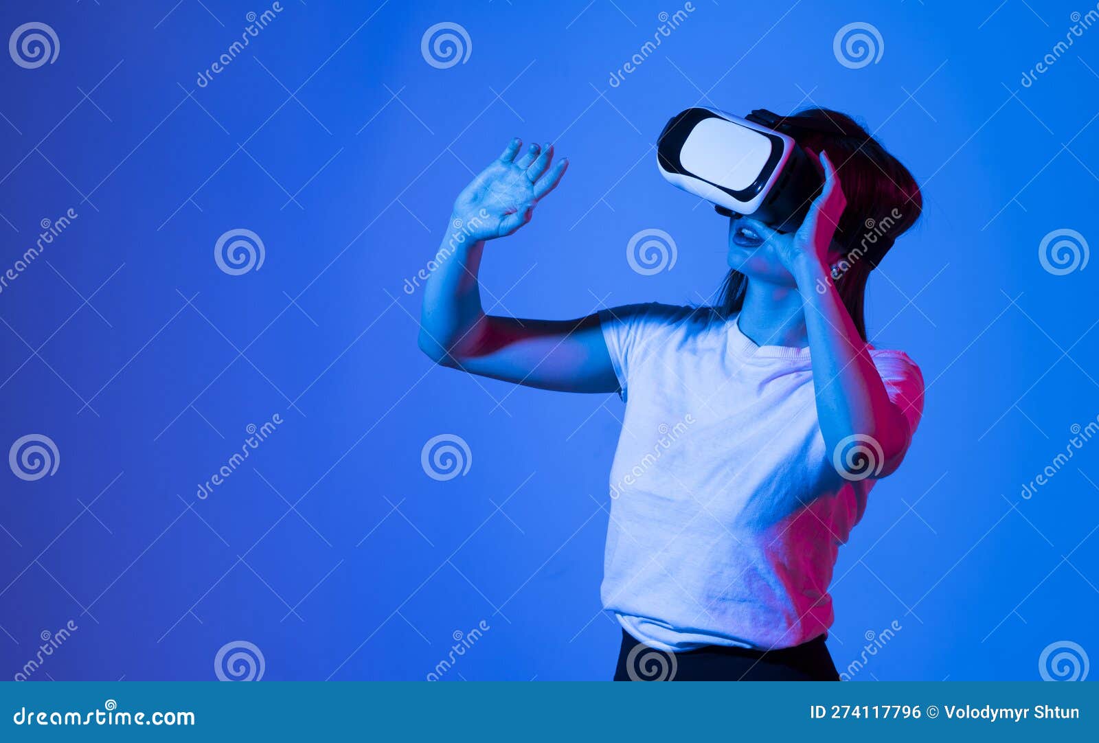 Woman in VR Headset Using Finger To Touch on Imaginary Panel Viewing on ...