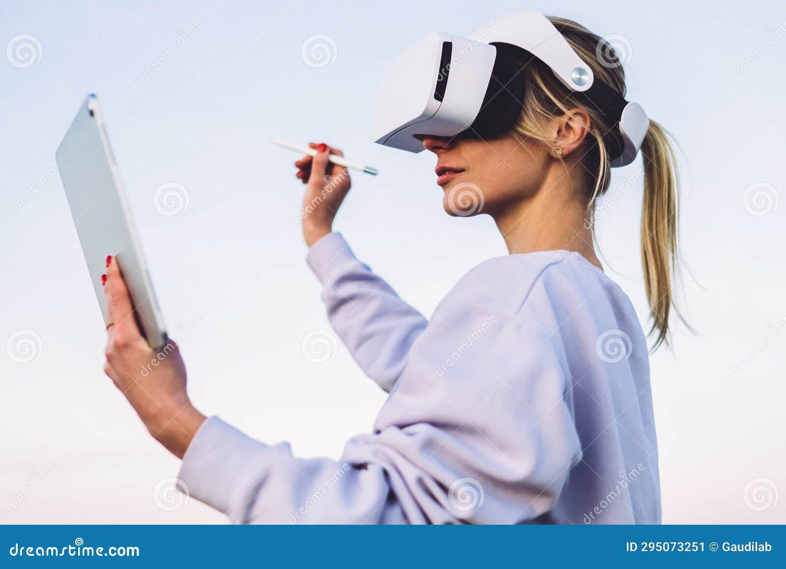 Woman in VR Headset Using Touchpad and Stylus for Virtual Reality Stock ...