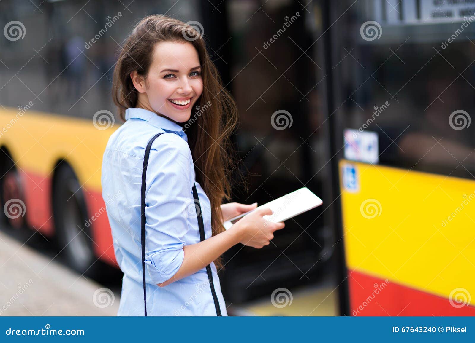 Woman waiting at bus stop stock photo. Image of commuter - 67643240