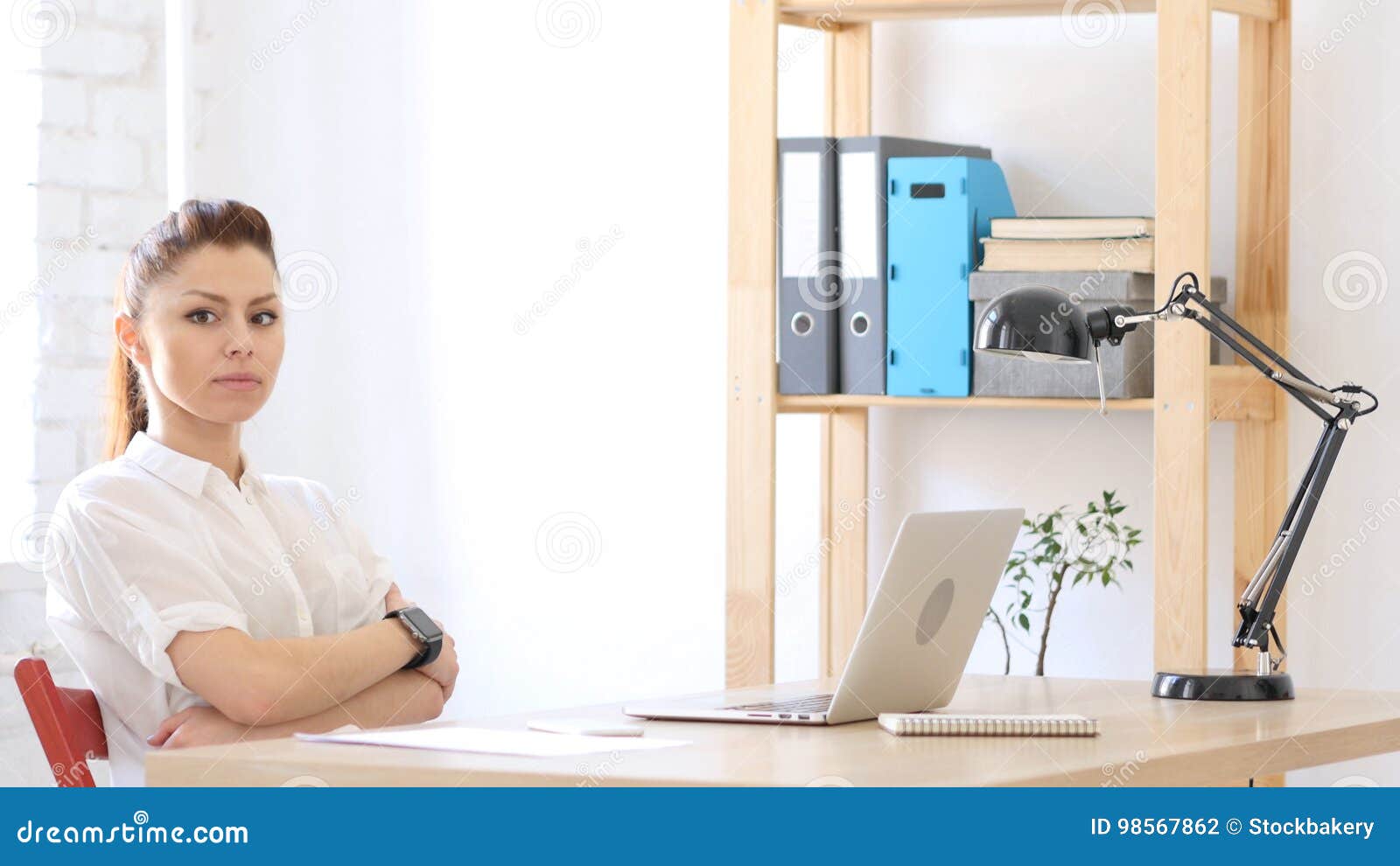 Woman Waiting at Work stock photo. Image of expression - 98567862