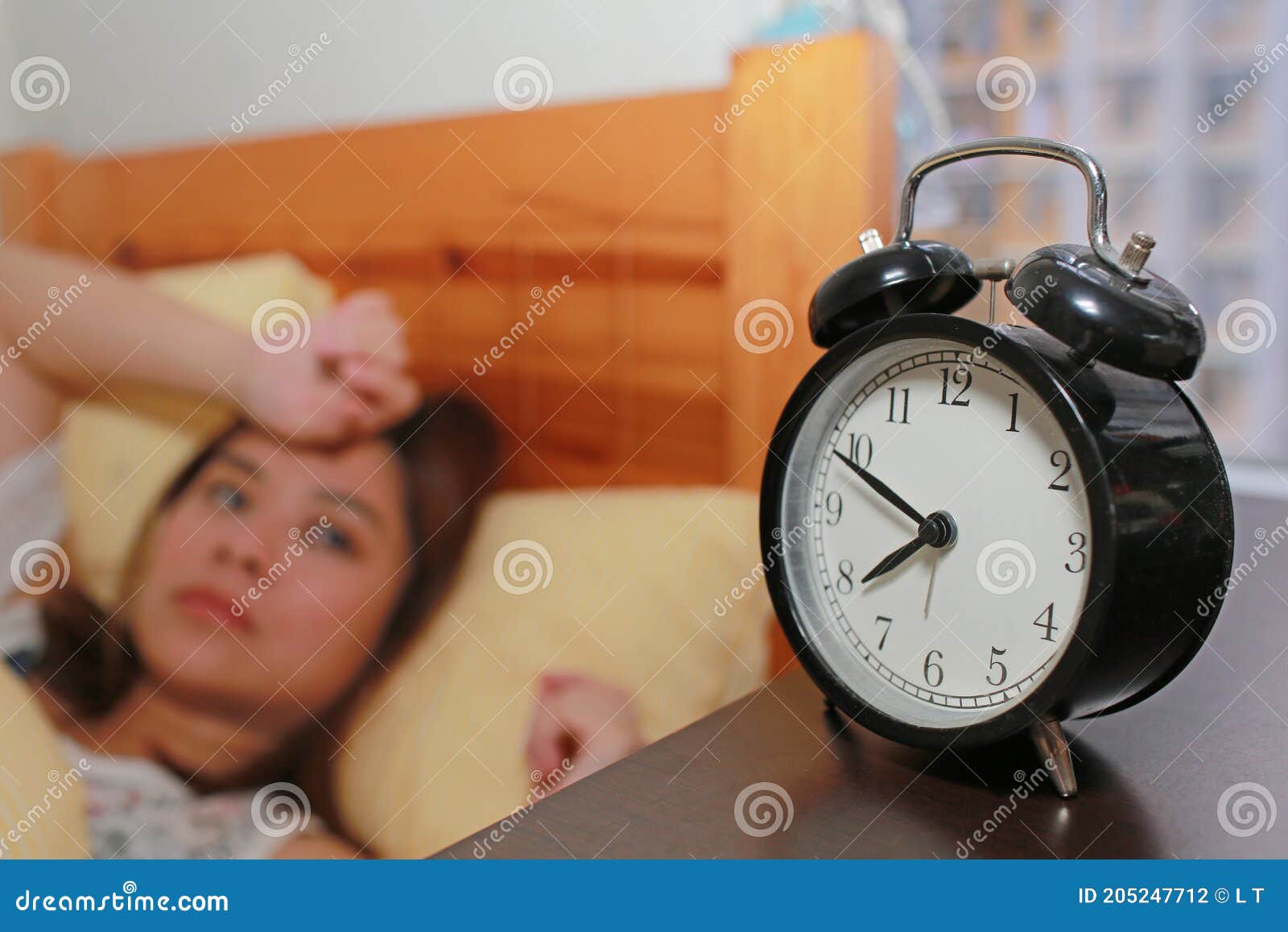 Woman wake up by the clock stock photo. Image of clock - 205247712