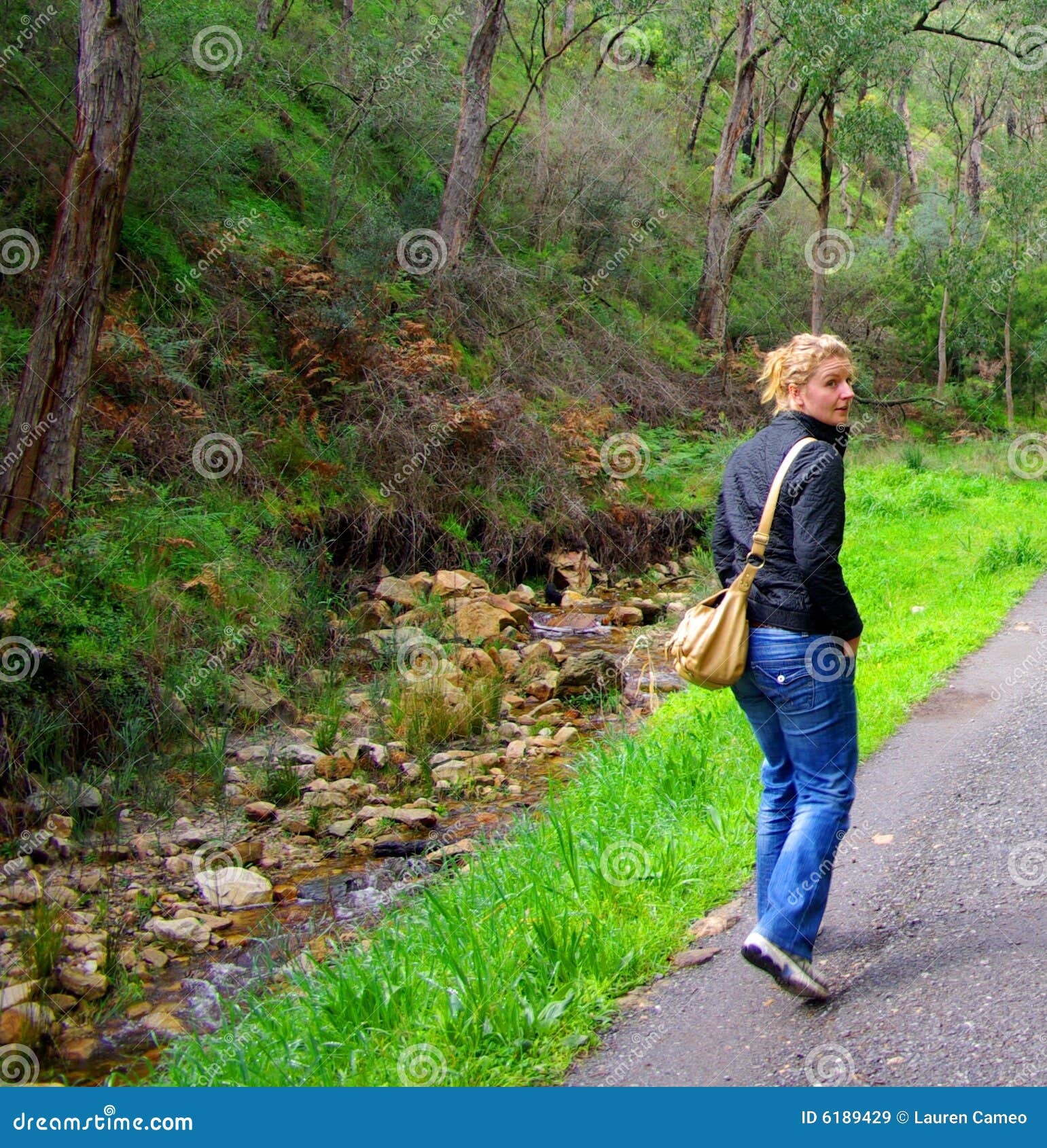 Woman Walking along Stream stock image. Image of hiking - 6189429