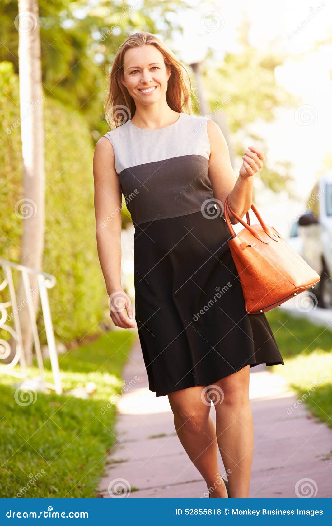 Woman Walking Along Street To Work Stock Photo - Image of commuter ...