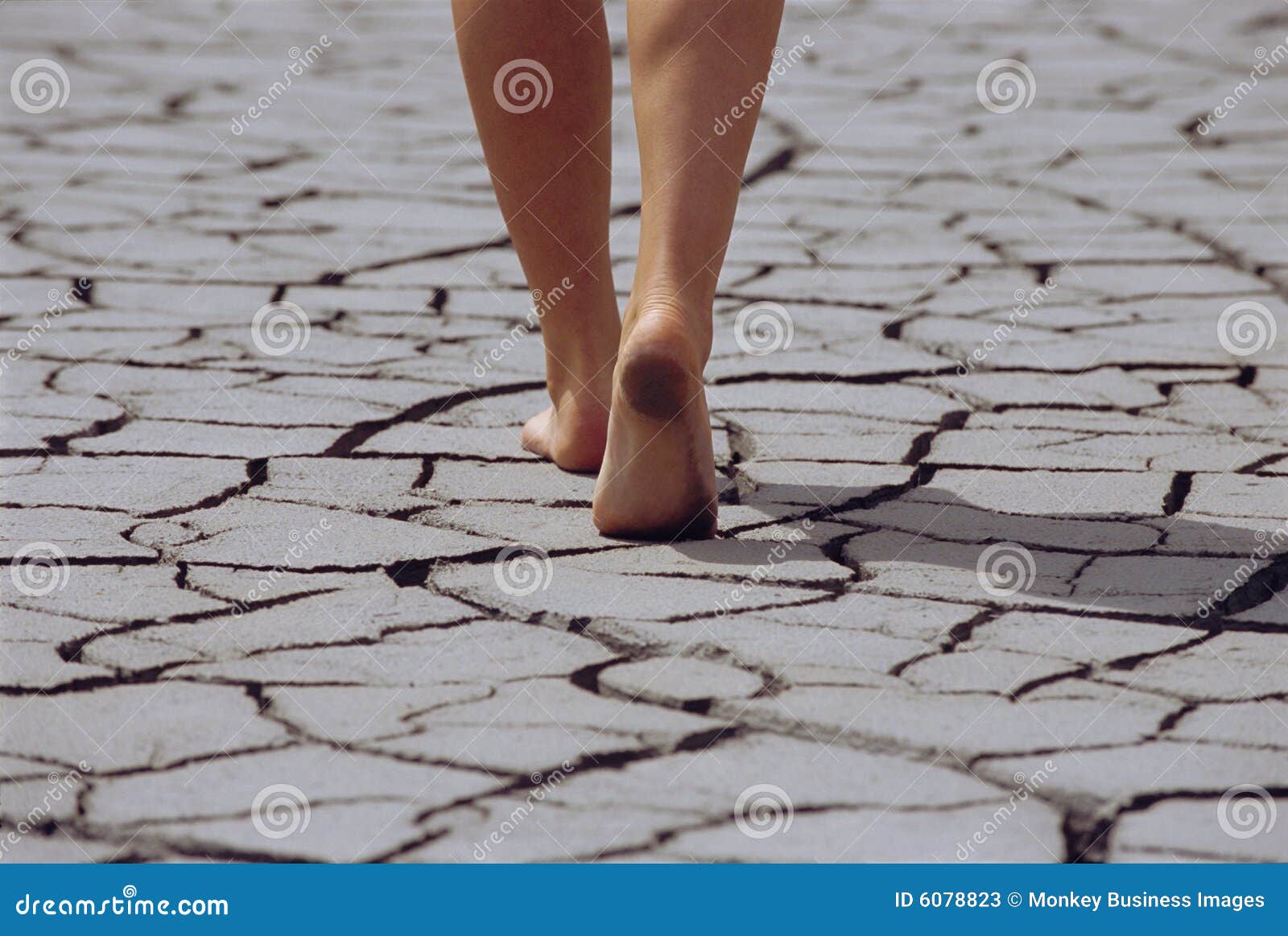 Woman Walking Barefoot Across Cracked Earth Stock Photos - Image: 6078823