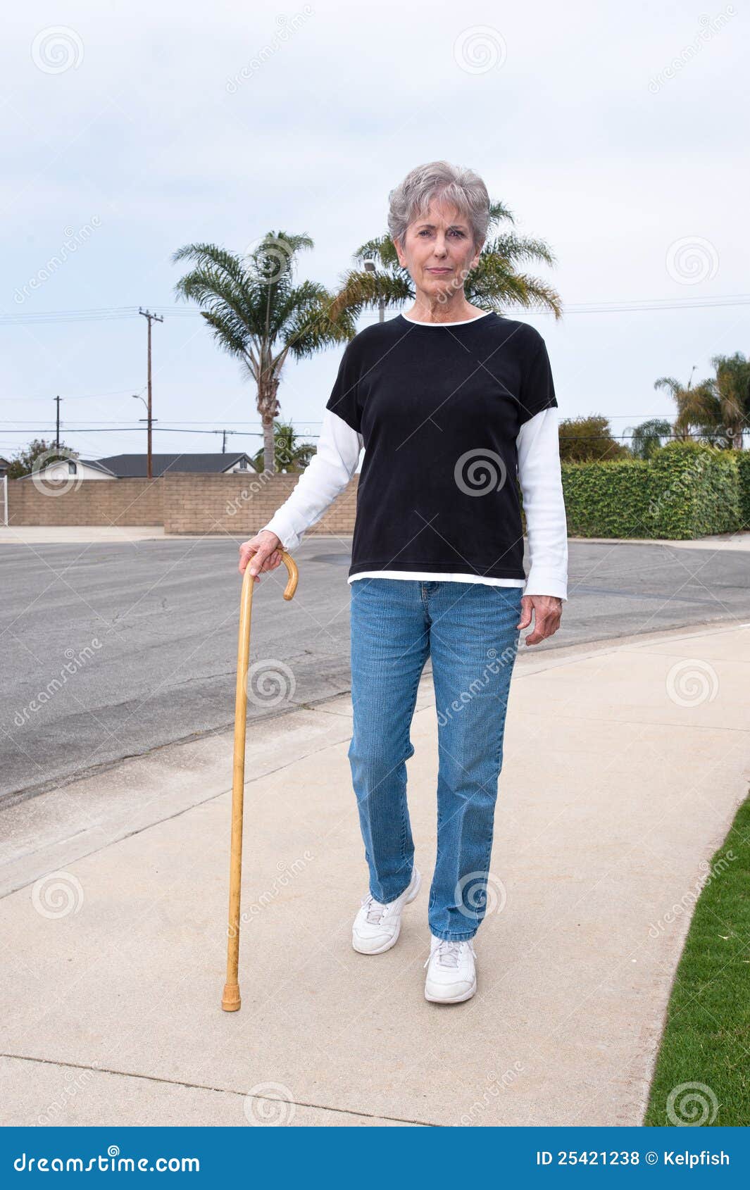 Woman walking with cane stock photo. Image of mature - 25421238