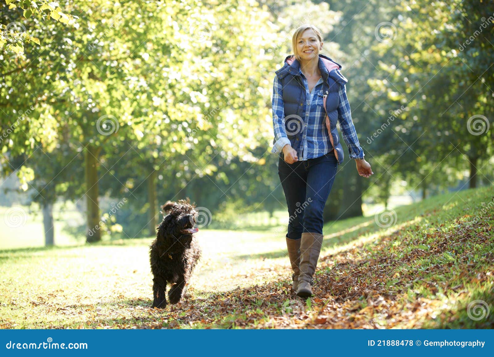 Woman walking dog stock photo. Image of affection, canine - 21888478