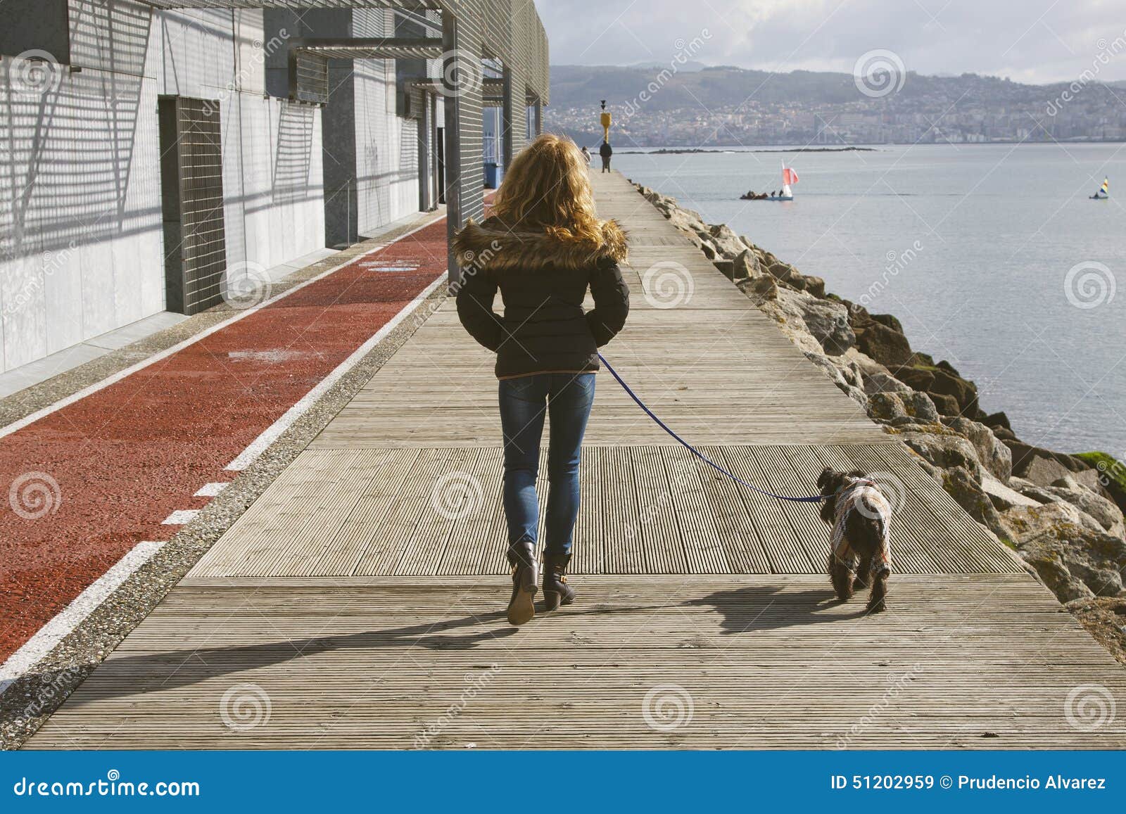 Woman walking the dog stock image. Image of happy, beautiful - 51202959