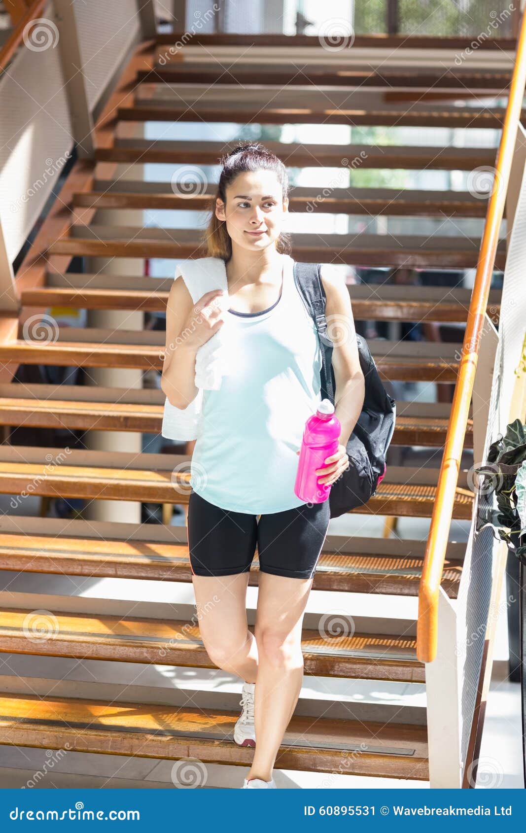 Woman walking down stairs stock image. Image of healthy - 60895531