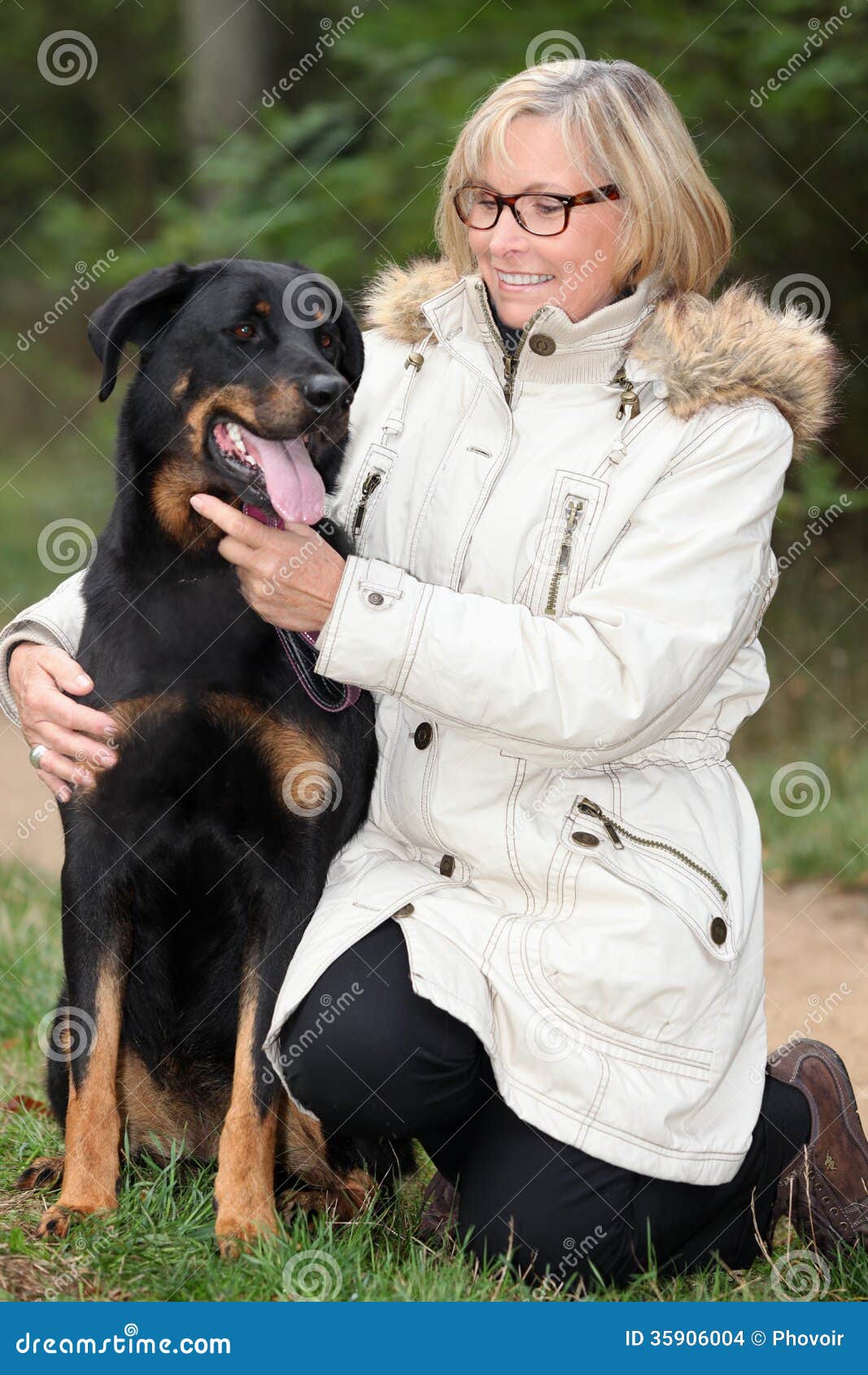 Woman walking her dog stock photo. Image of rottweiler - 35906004