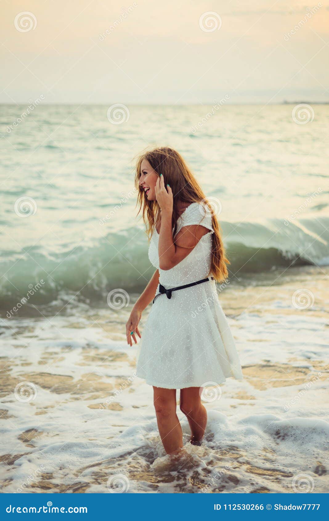 A Woman is Walking by the Sea Stock Photo - Image of beach, life: 112530266