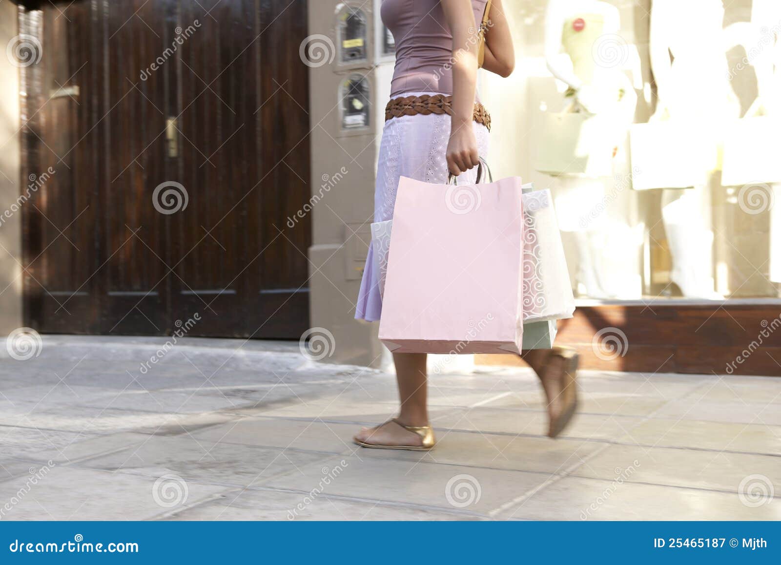 Woman Walking by Store stock image. Image of dynamic - 25465187