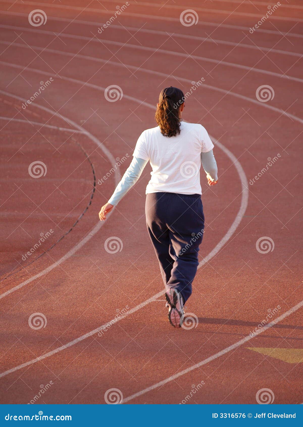 Woman Walking on Track stock photo. Image of woman, shirt - 3316576