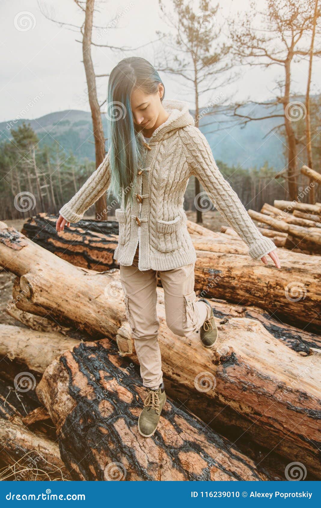 Woman Walking on Tree Trunks. Stock Photo - Image of travel, blue ...
