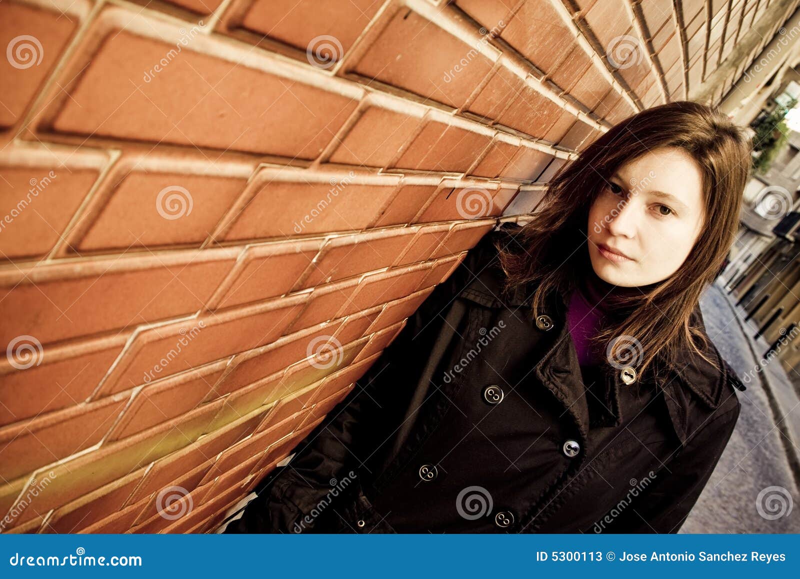 Woman on wall stock image. Image of dark, brickwall, attractive - 5300113
