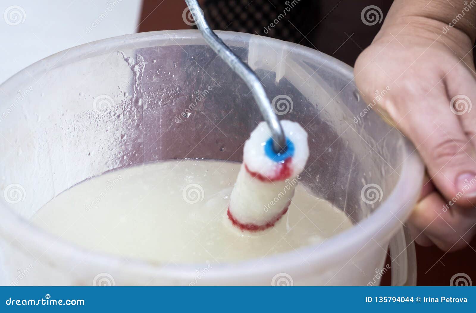 Woman with Wallpaper and Roller, Glue in Bucket for Work Stock Photo ...