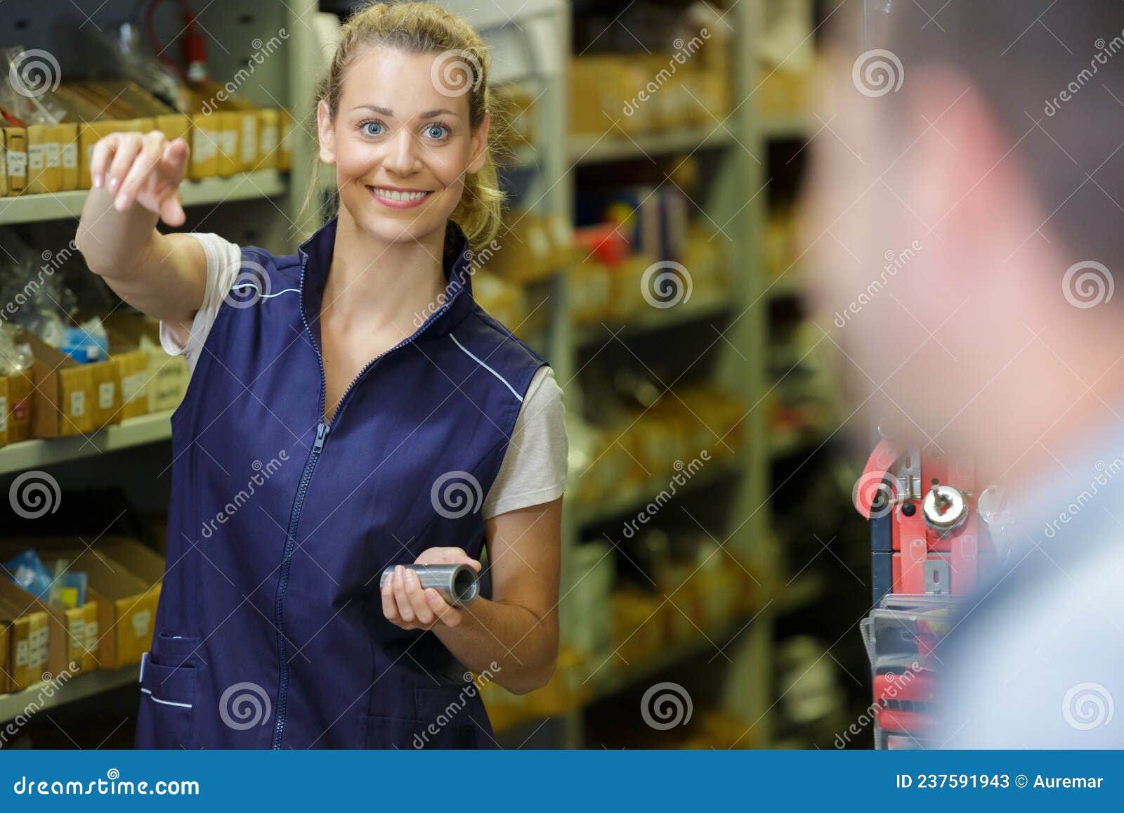 Woman in Warehouse Pointing at Co-worker Stock Image - Image of small ...
