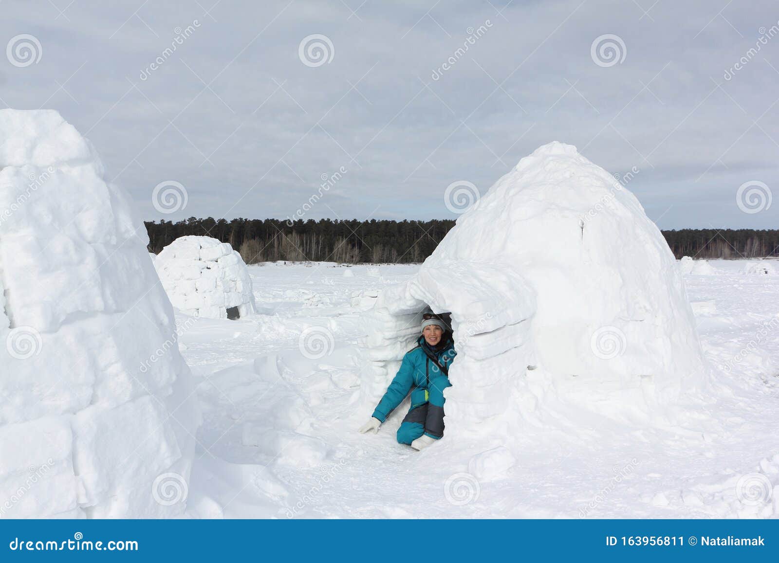 Woman Sitting by an Igloo in Winter Stock Image - Image of cold ...
