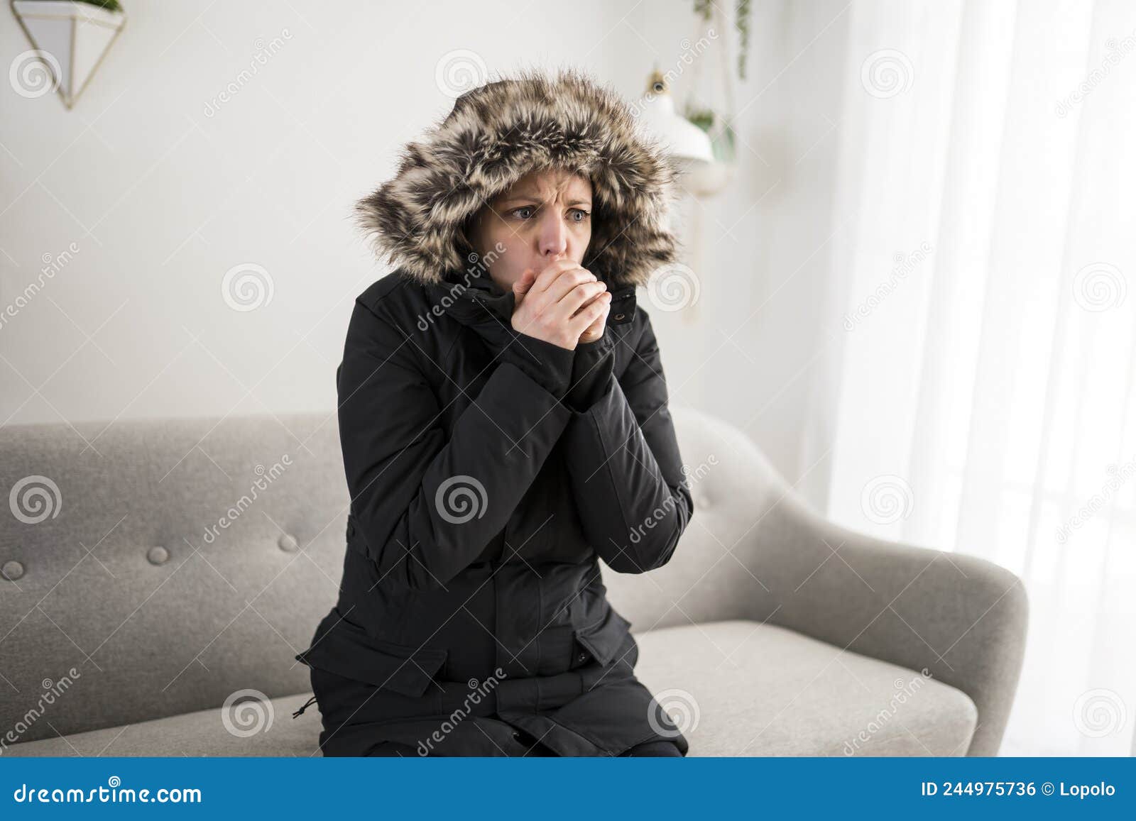 Woman with Warm Clothing Feeling the Cold Inside House on the Sofa ...