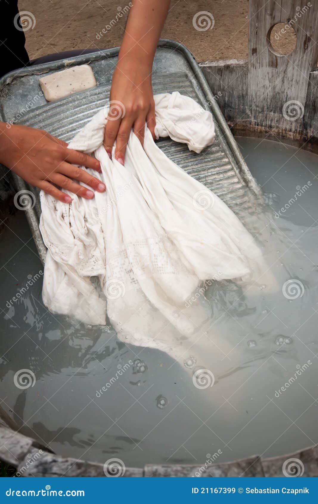 Woman Washing Clothes By Hand