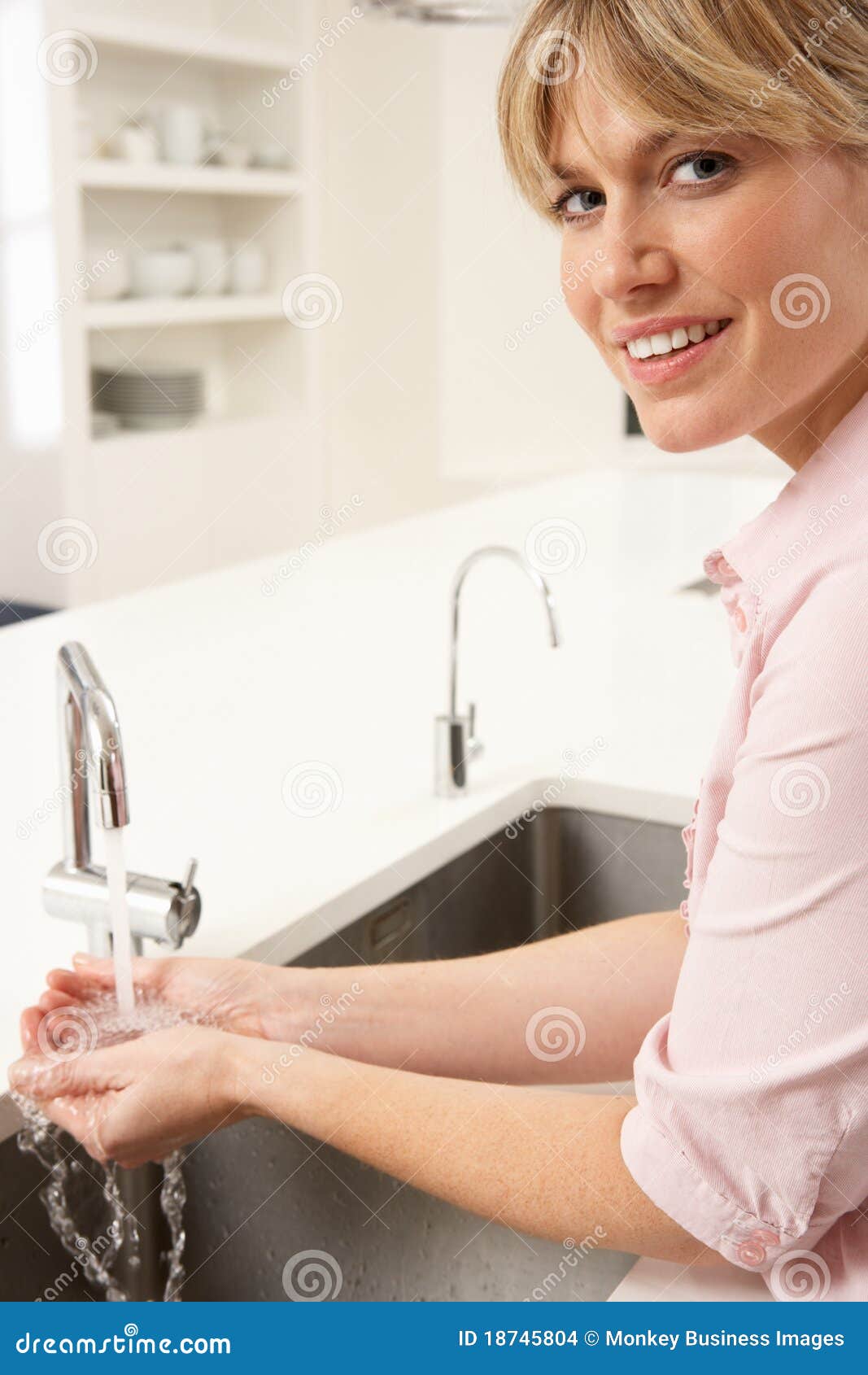 Woman Washing Hands at Kitchen Sink Stock Photo - Image of indoors ...