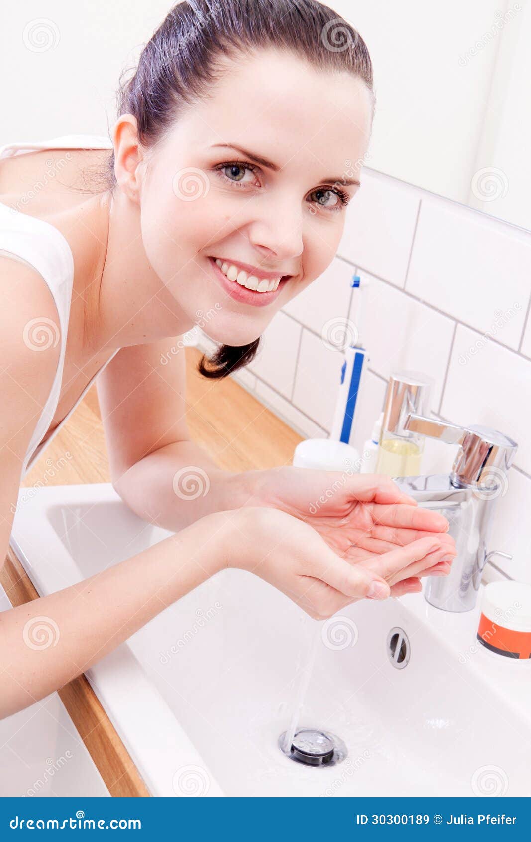 Woman Washing Her Face in Bathroom Stock Image - Image of adult ...