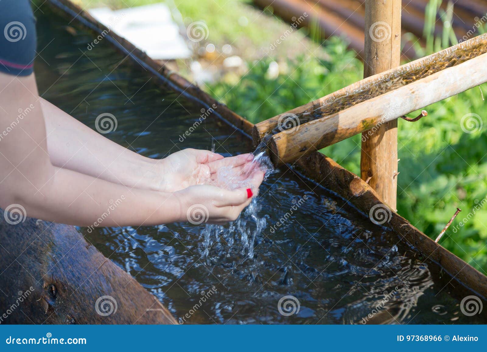 Woman Washing Her Hands in a Stream Stock Photo - Image of mountain ...