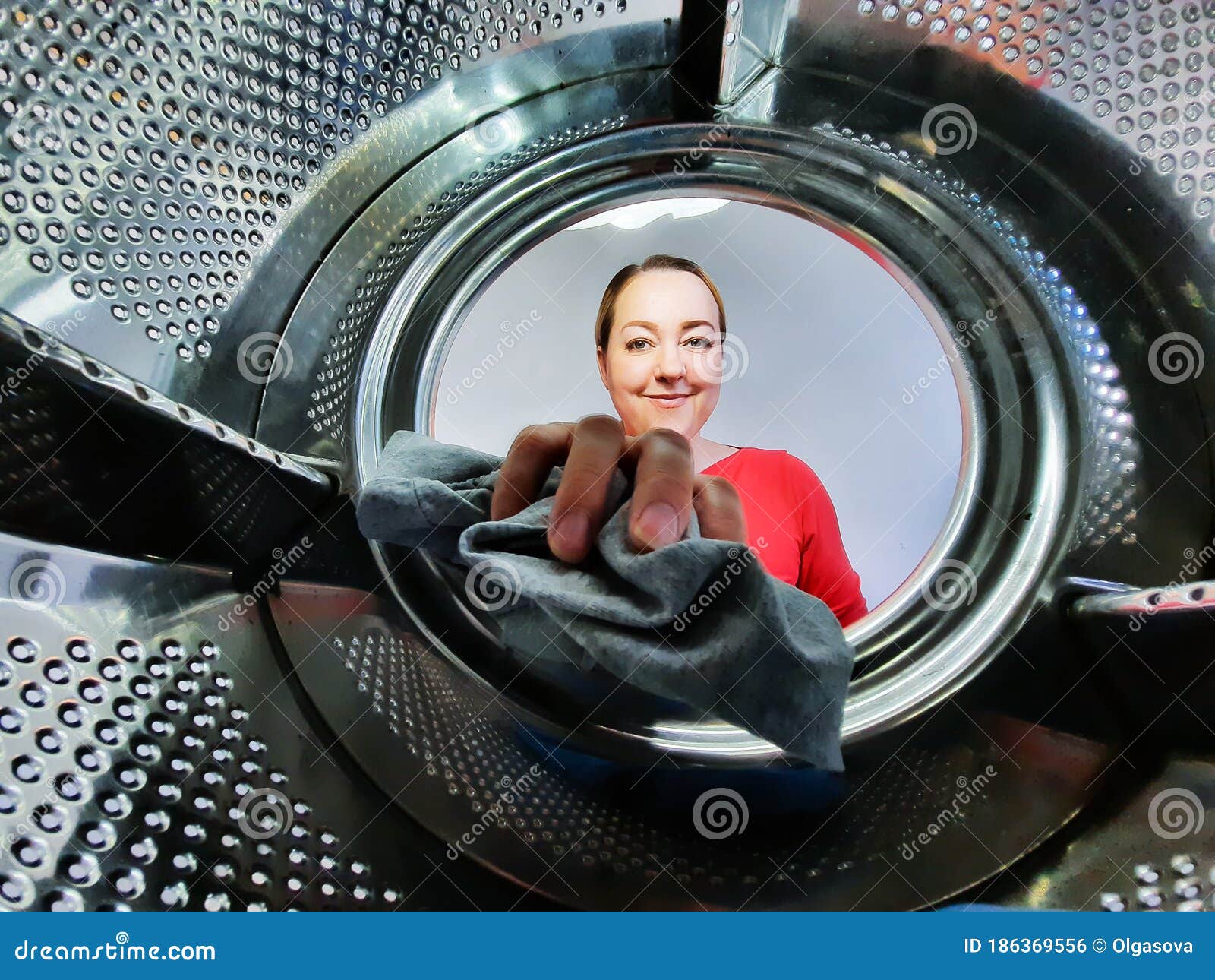 Woman washing machine stock photo. Image of clothes - 186369556