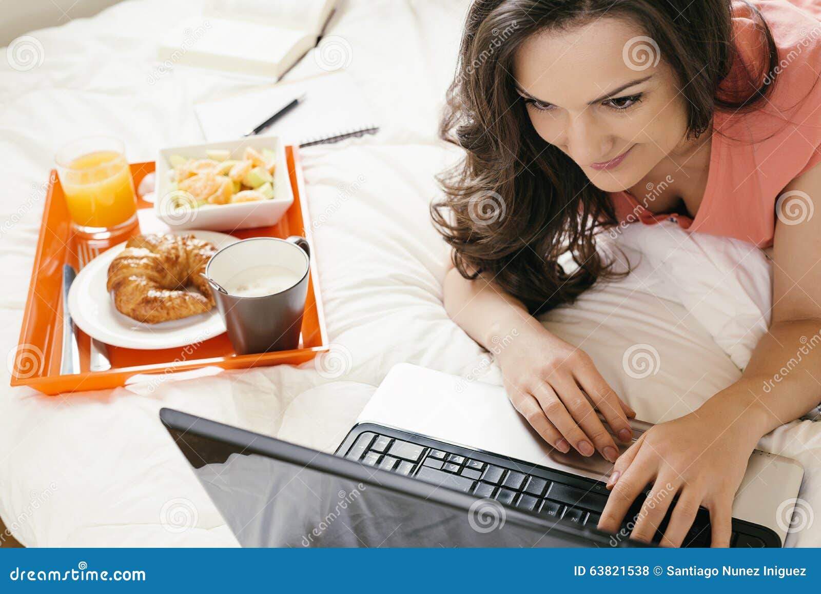 Woman Watching the Laptop Computer and Having Breakfast Stock Photo ...