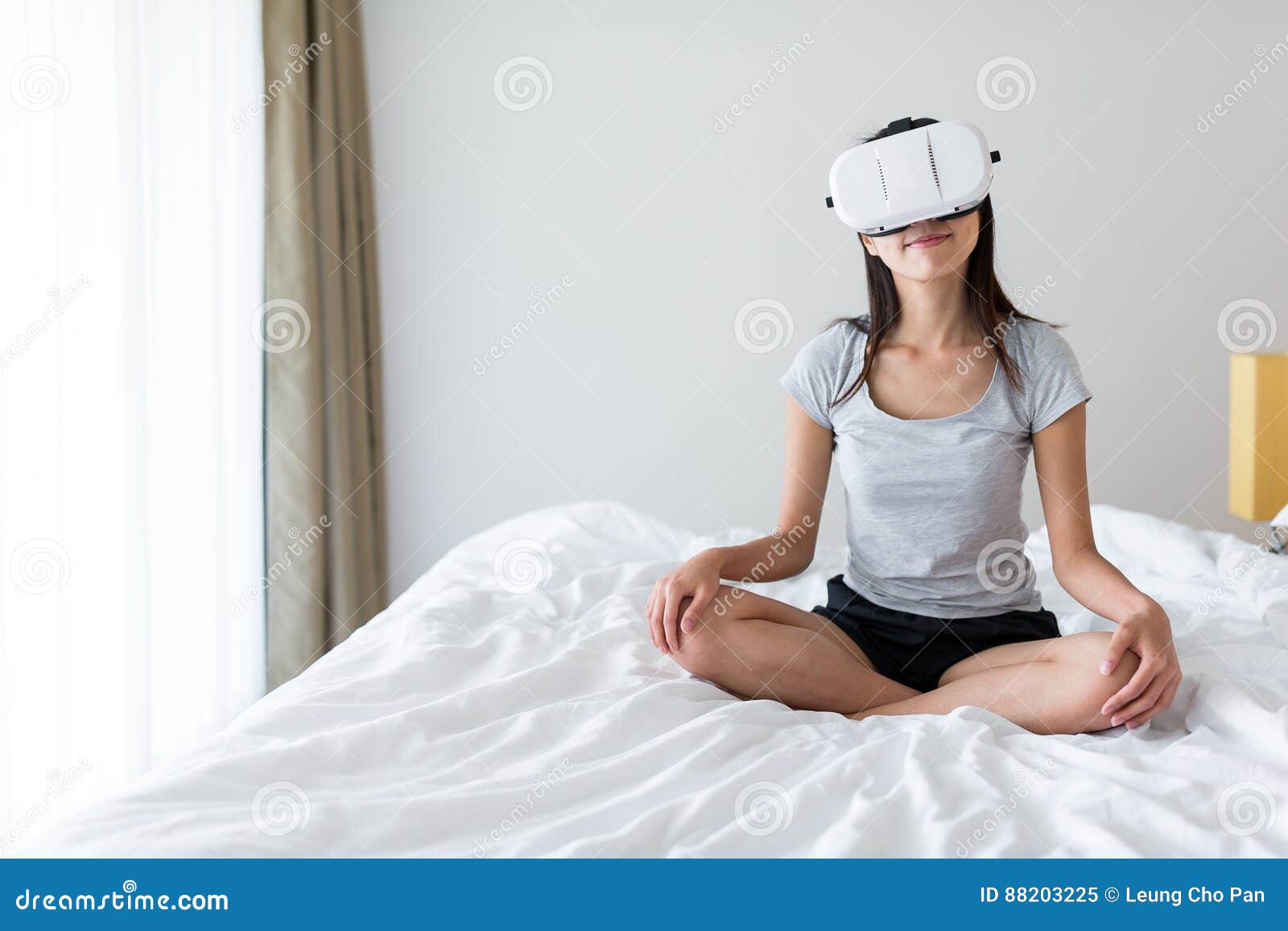 Woman Watching Virtual Reality Device on Bed Stock Image - Image of ...