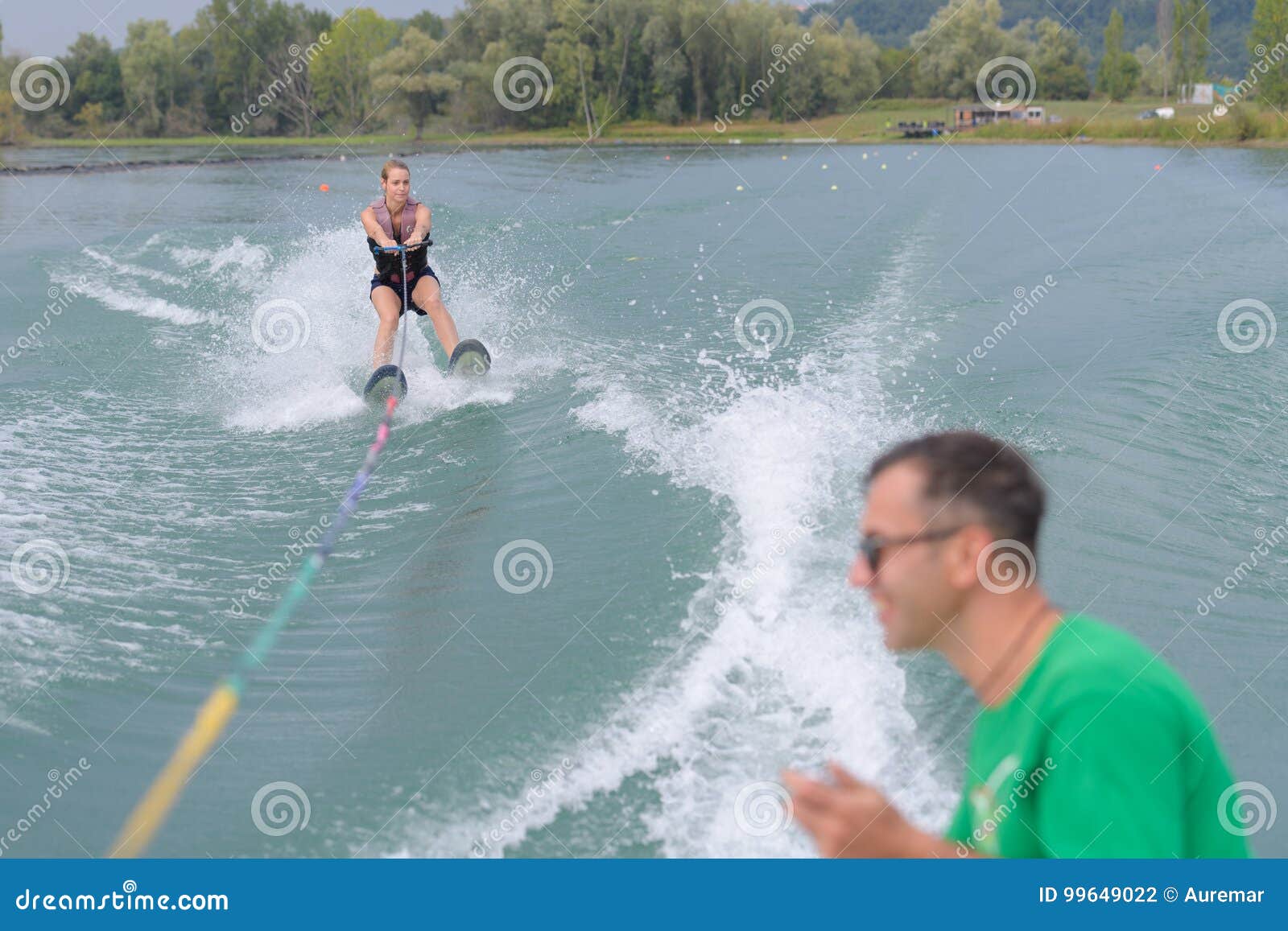 Woman water skiing on sea stock photo. Image of vacations - 99649022