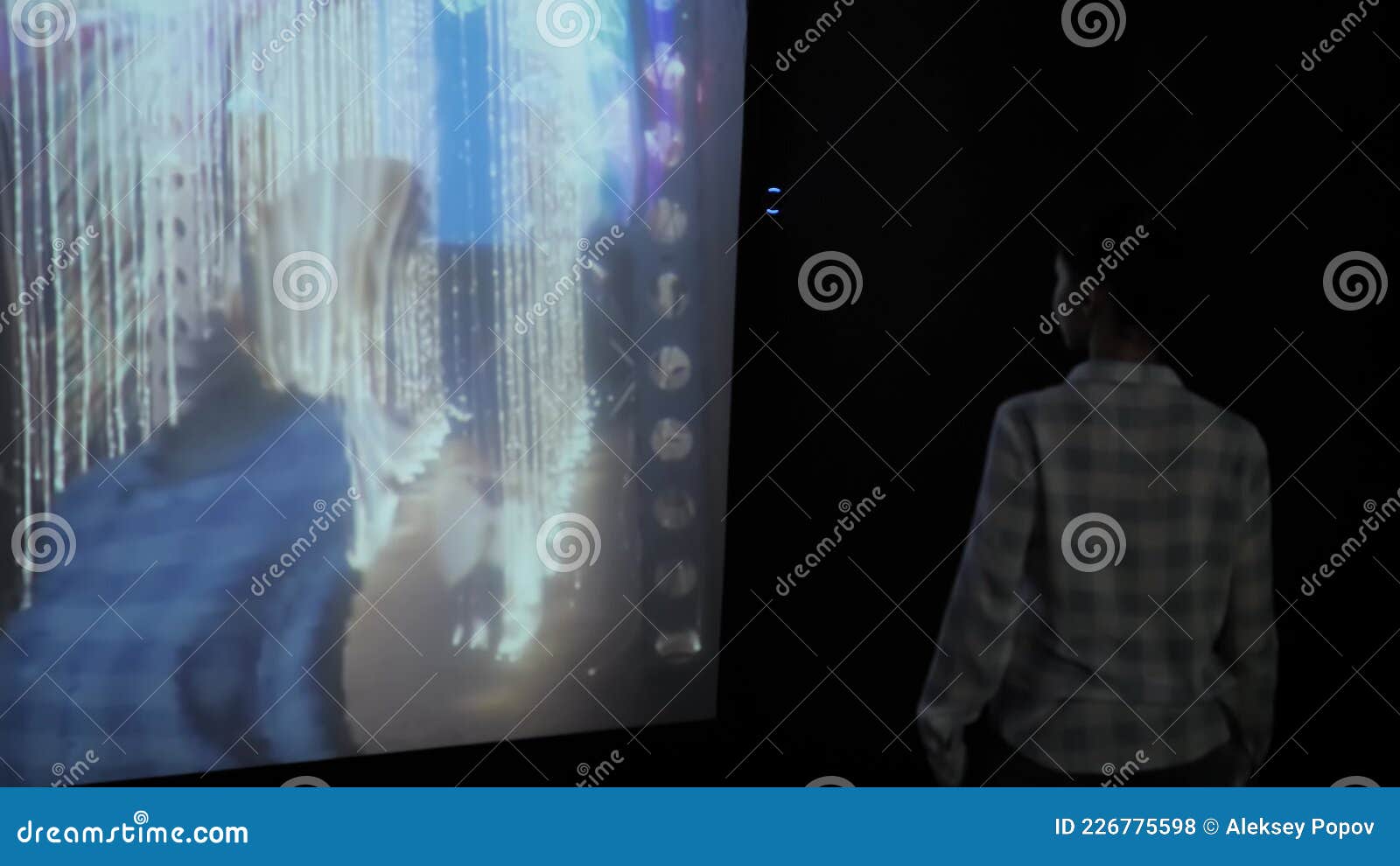 Woman Waving Arms and Dancing in Front of Wall Display - AR Concept ...