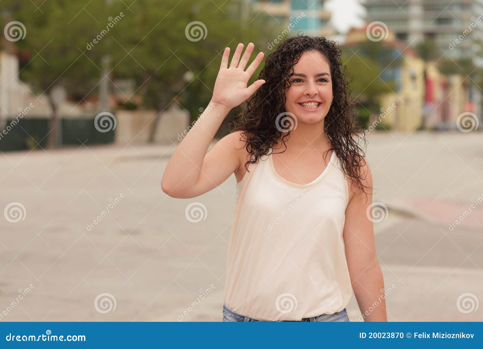 Woman waving and smiling stock photo. Image of lady, urban - 20023870