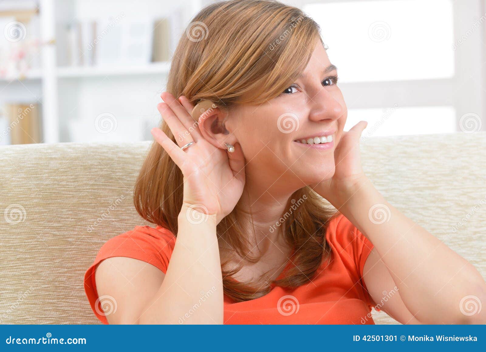 Woman wearing deaf aid stock image. Image of otolaryngology - 42501301
